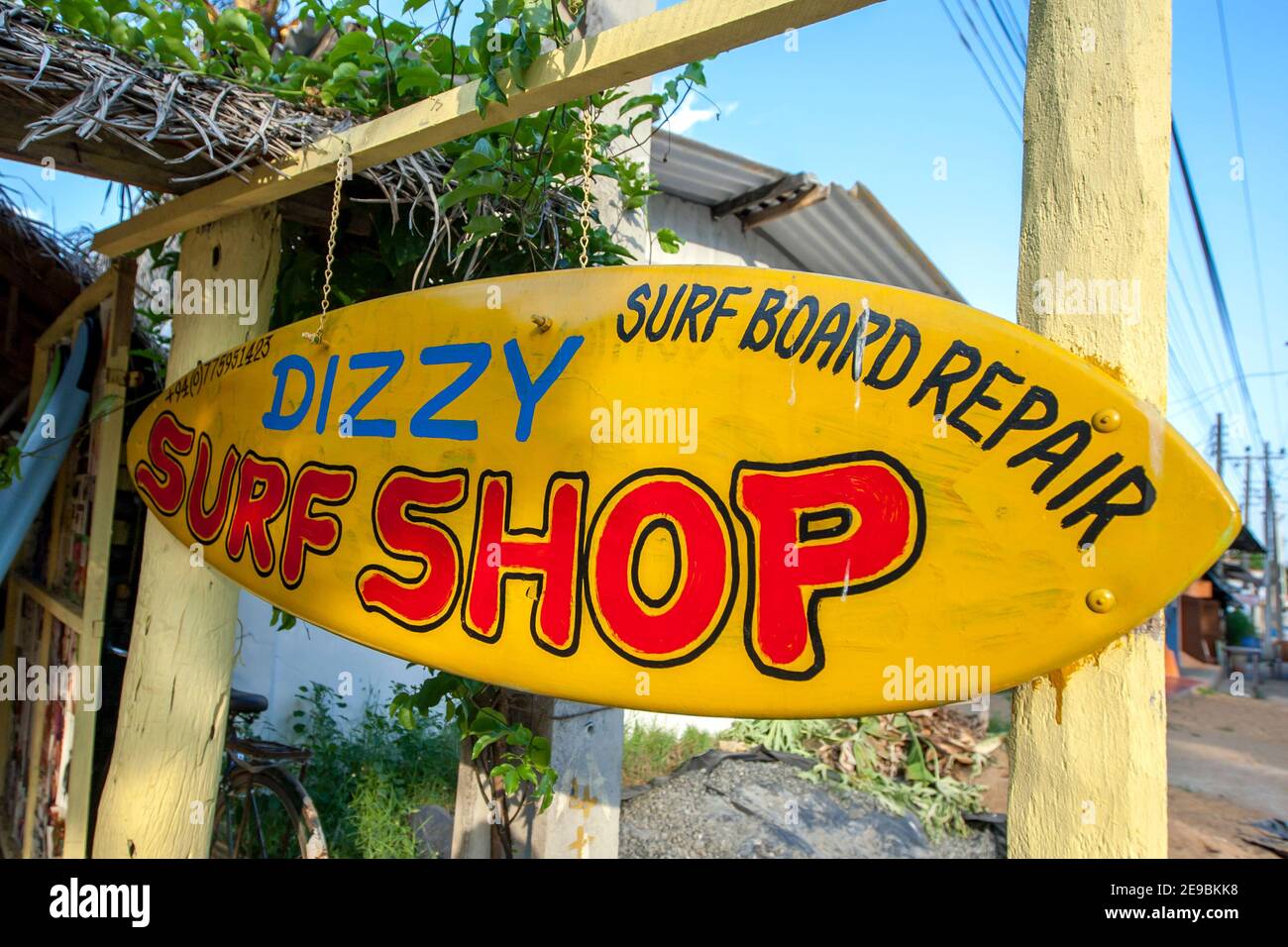 A surfboard advertising the Dizzy Surf Shop. It is located on Panama ...