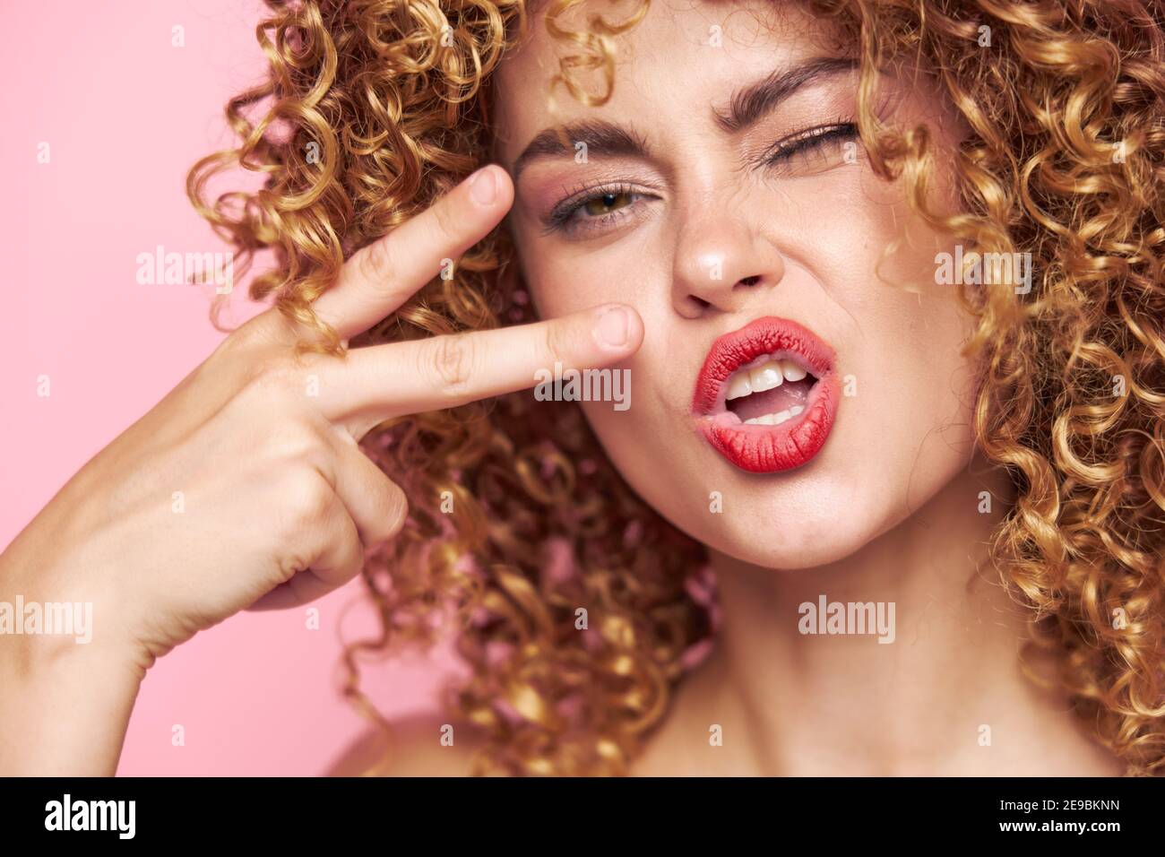 Beautiful woman Makeup on the face and two fingers fashion background ...