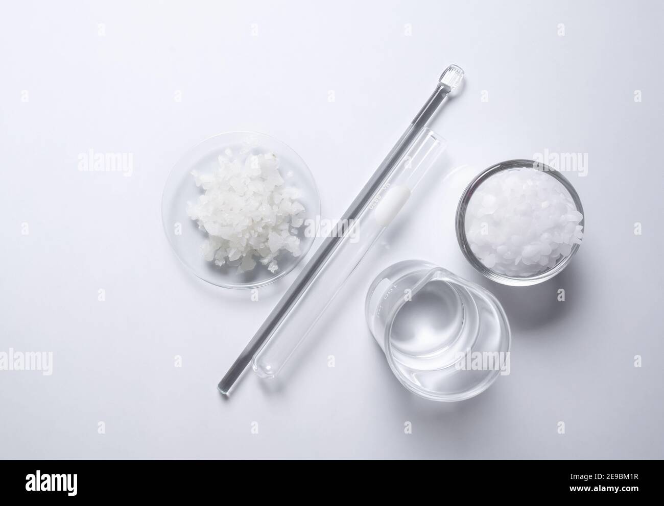 Crystal clear liquid in beaker, Microcrystalline wax in glass container ...