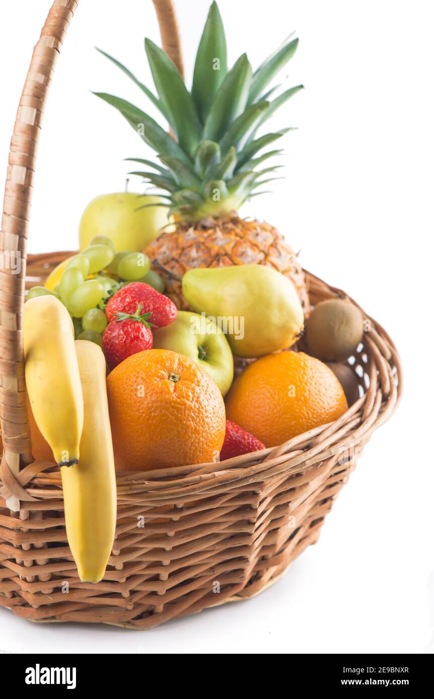 Fresh fruit in the basket against a white Stock Photo - Alamy