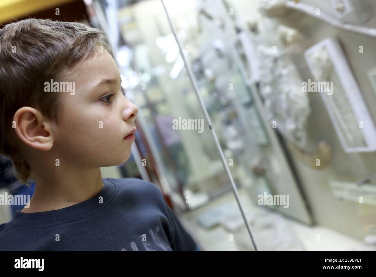 Portrait of a thinking child in a museum Stock Photo - Alamy