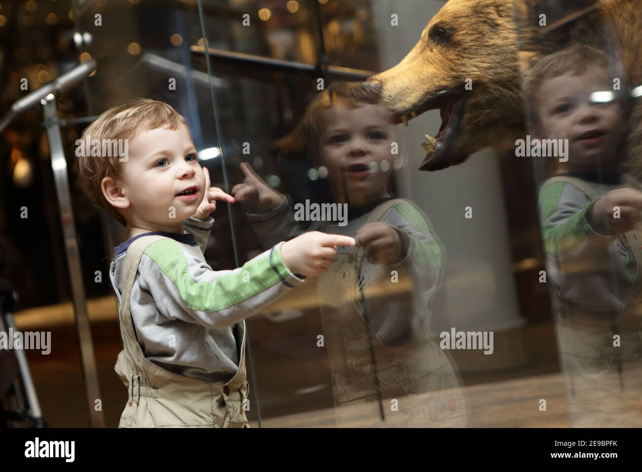 Portrait of curiosity kid in a museum Stock Photo - Alamy