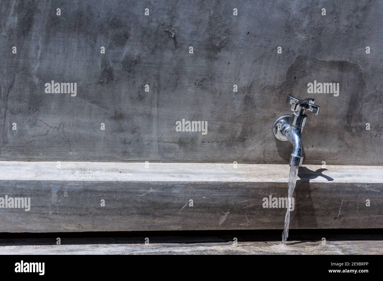 Water out from public faucet Stock Photo - Alamy