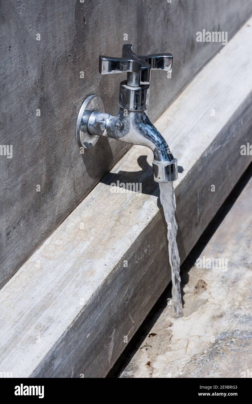 Water out from public faucet Stock Photo - Alamy