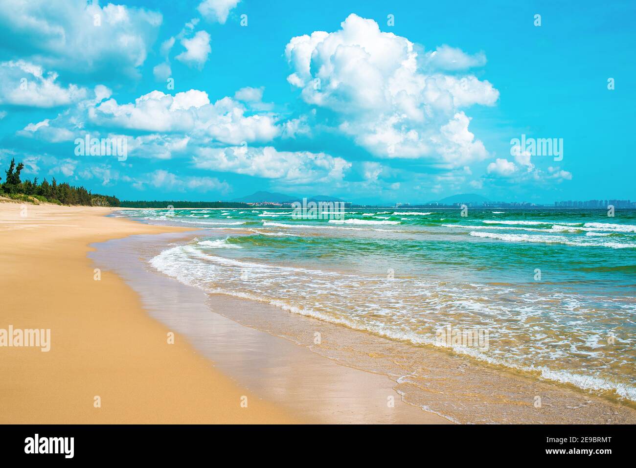 Beautiful seascape. Yellow sand beach, azure sea and blue sky with ...