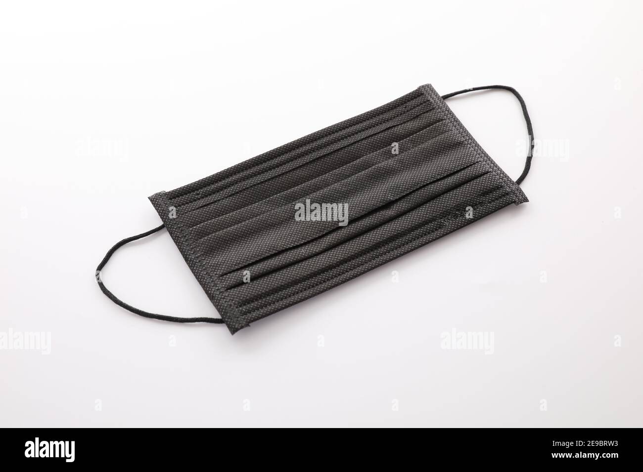 Used black mask isolated in white background Stock Photo - Alamy