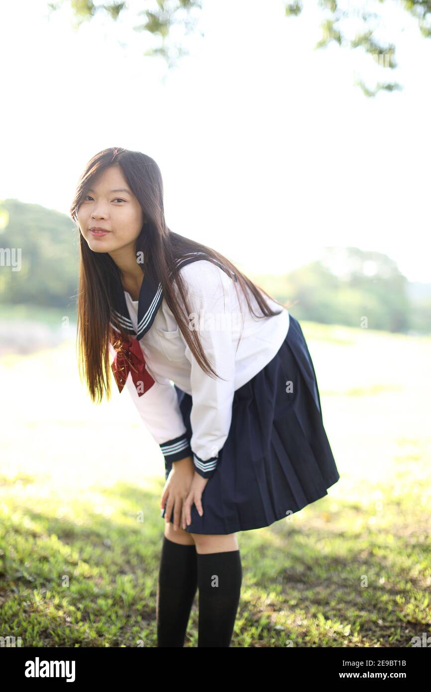 Asian school girl with countryside background Stock Photo - Alamy