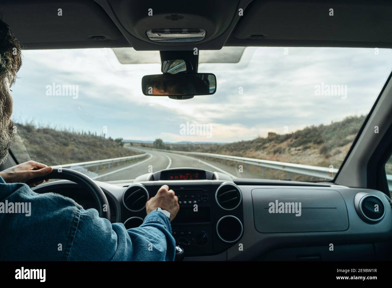 man driving a van from the rear view on the road Stock Photo - Alamy