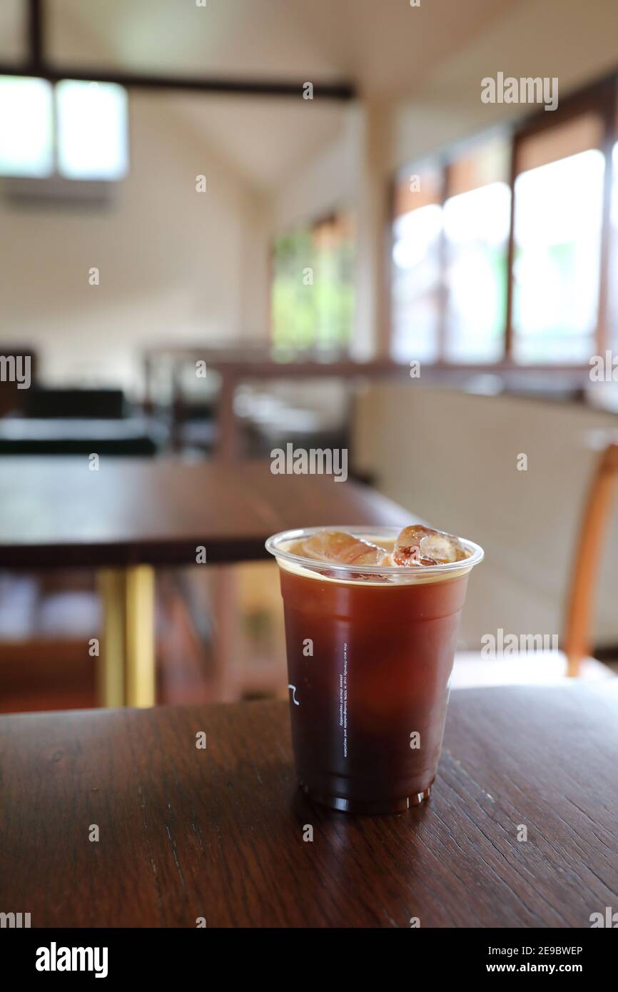 ice coffe on wood table in local coffee shop Stock Photo - Alamy