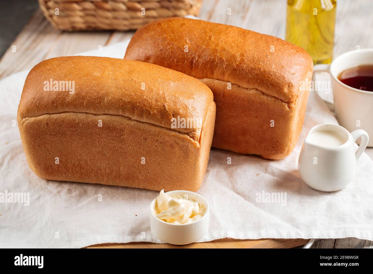 Loafs of white brick shaped bread with butter Stock Photo - Alamy