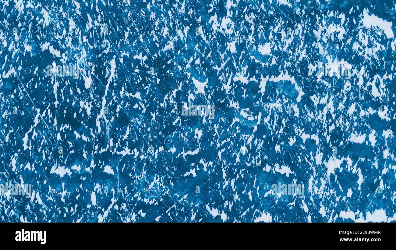 Blue ice surface with scratches and snow Stock Photo - Alamy