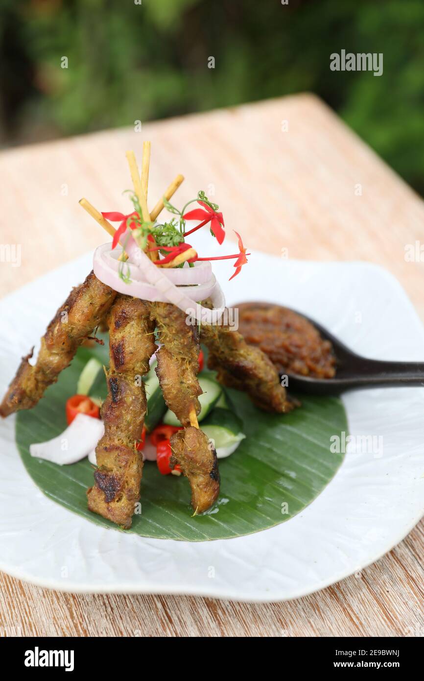 Chicken Satay on dark brown table street food appetizer Stock Photo - Alamy