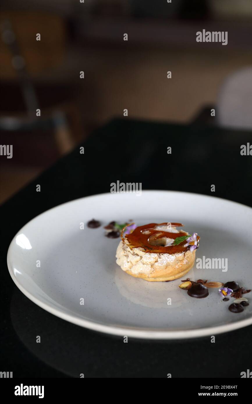 Chocolate dessert cake with berry sauce and almond with decorated Stock ...