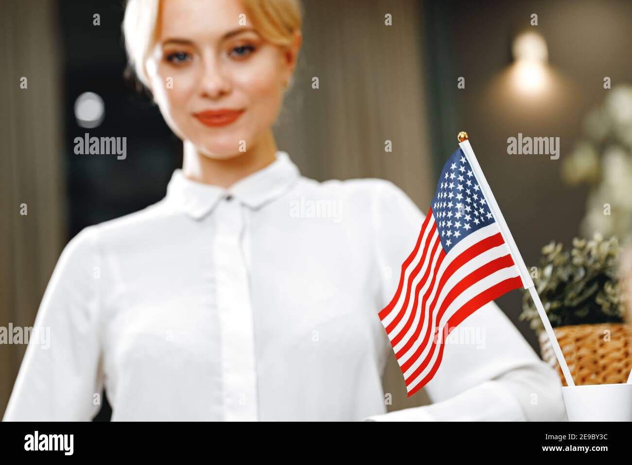 Portrait of beautiful blonde woman hotel receptionist Stock Photo - Alamy