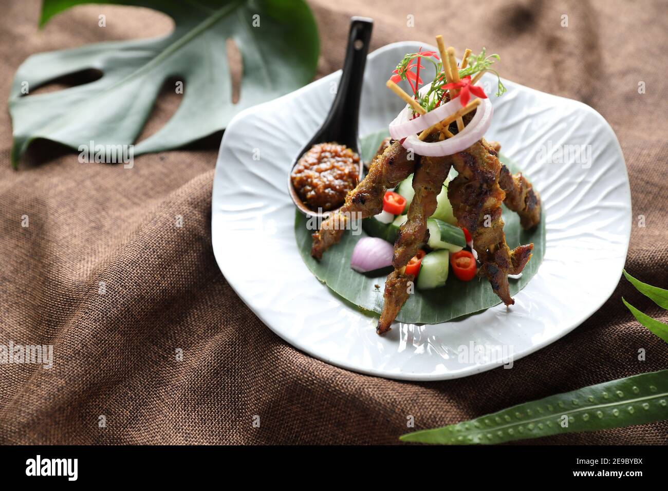 Chicken Satay on dark brown table street food appetizer Stock Photo - Alamy