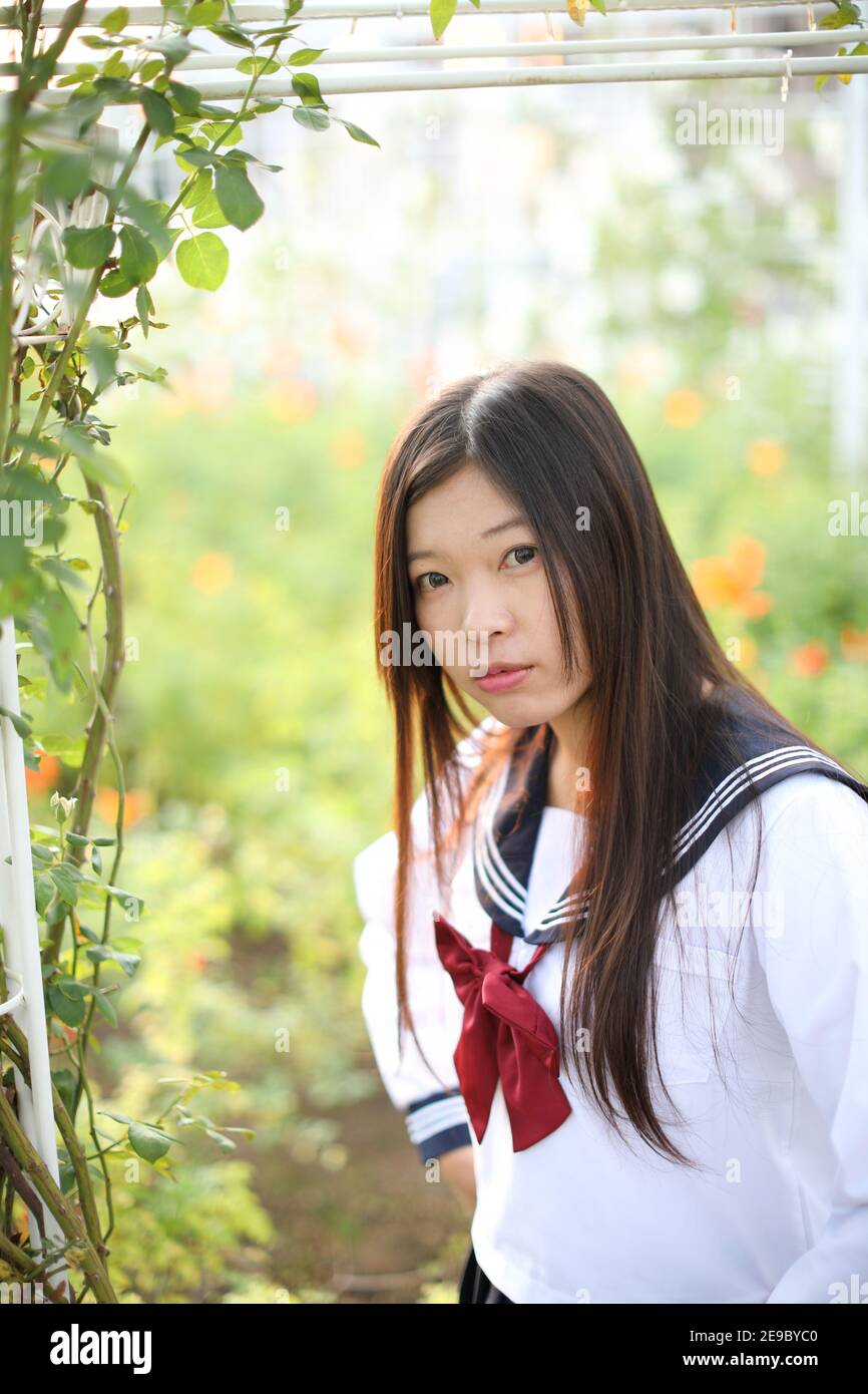 school girl costume at park outdoor with flowers garden background ...