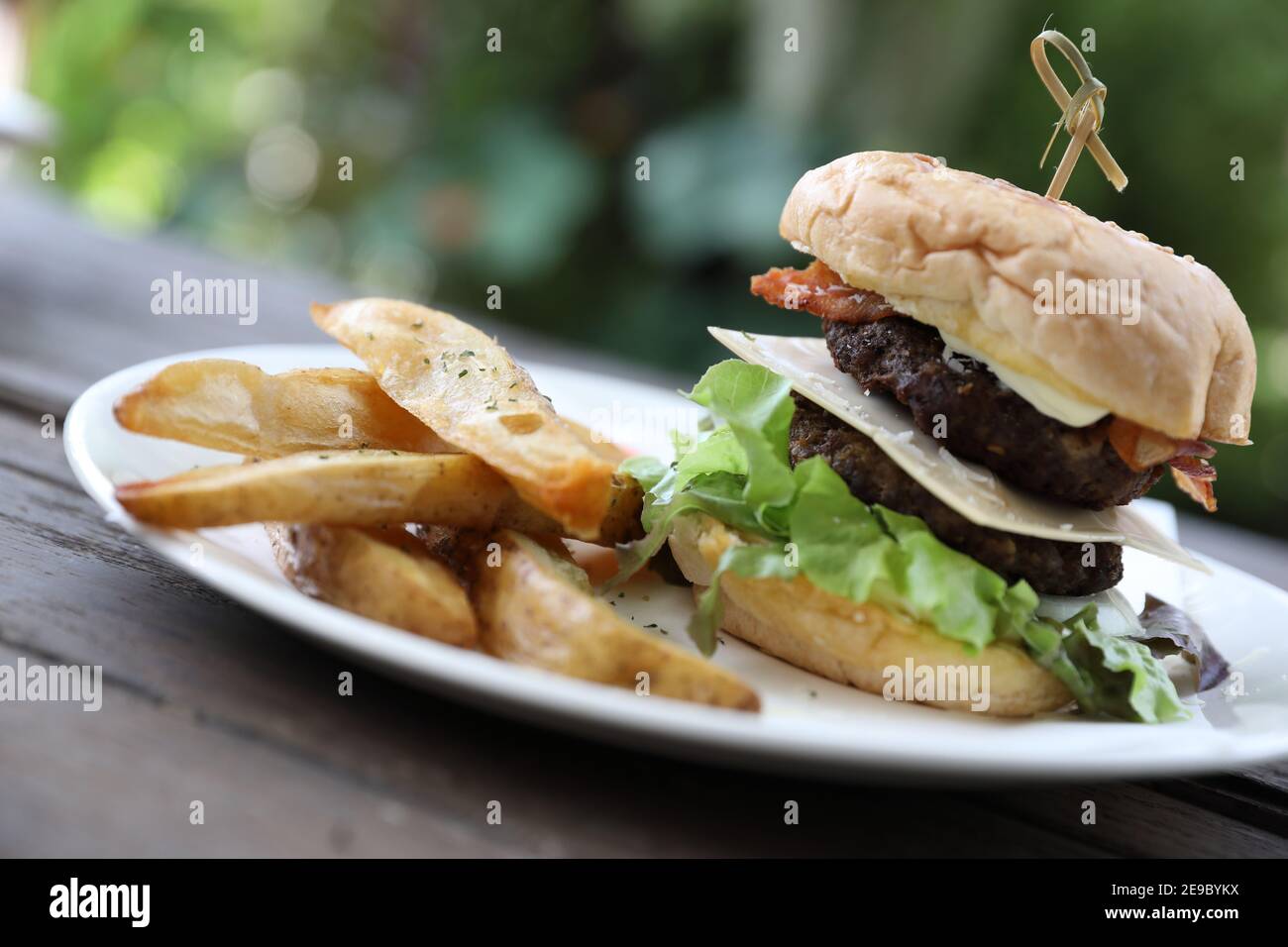 Beef Hamburger on wood background Stock Photo - Alamy