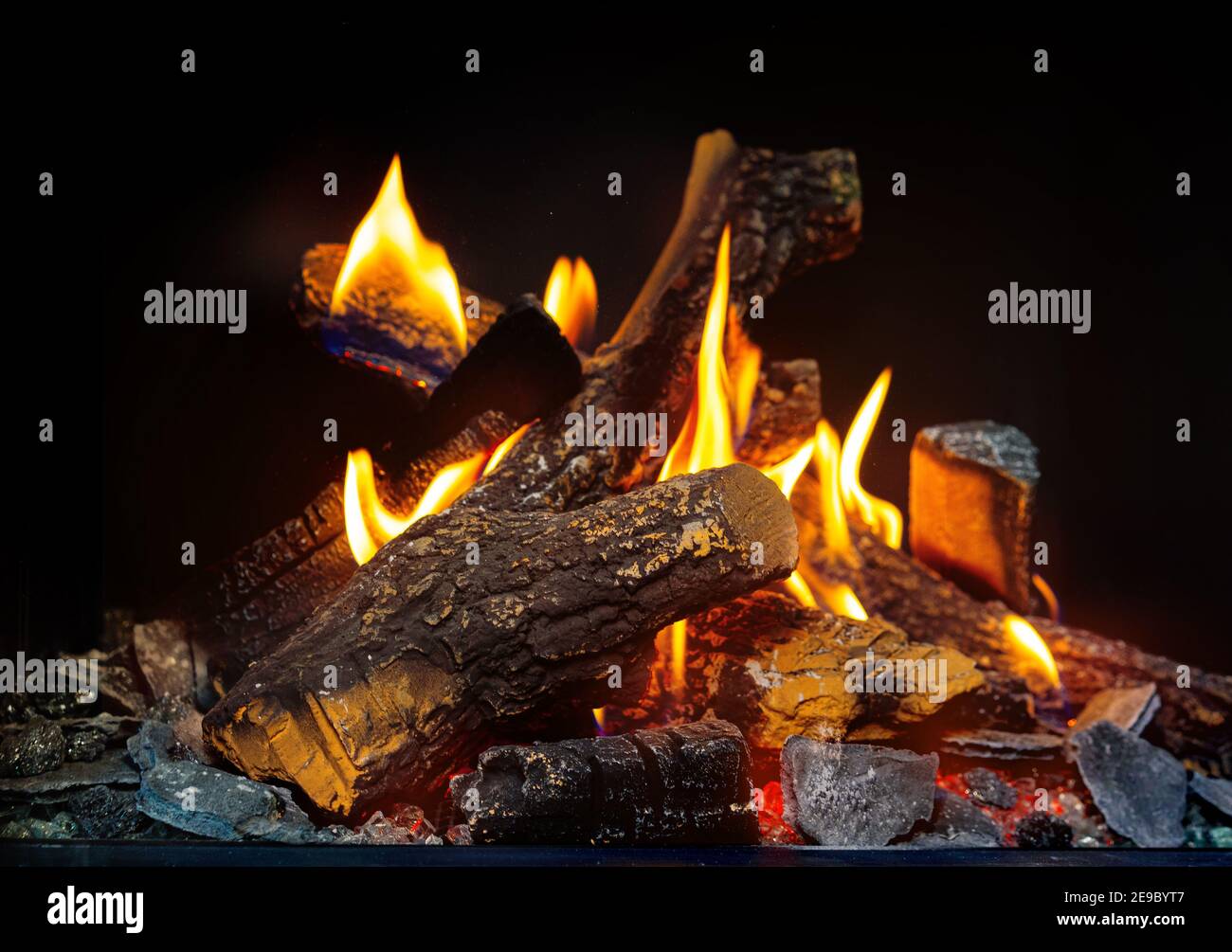Wood logs burning in fireplace close up Stock Photo - Alamy
