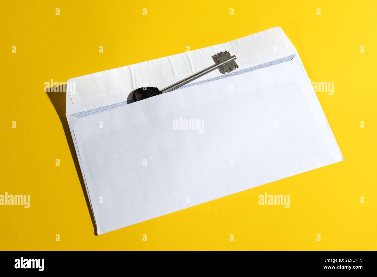 key in open mail envelop on yellow background. concept of solution ...