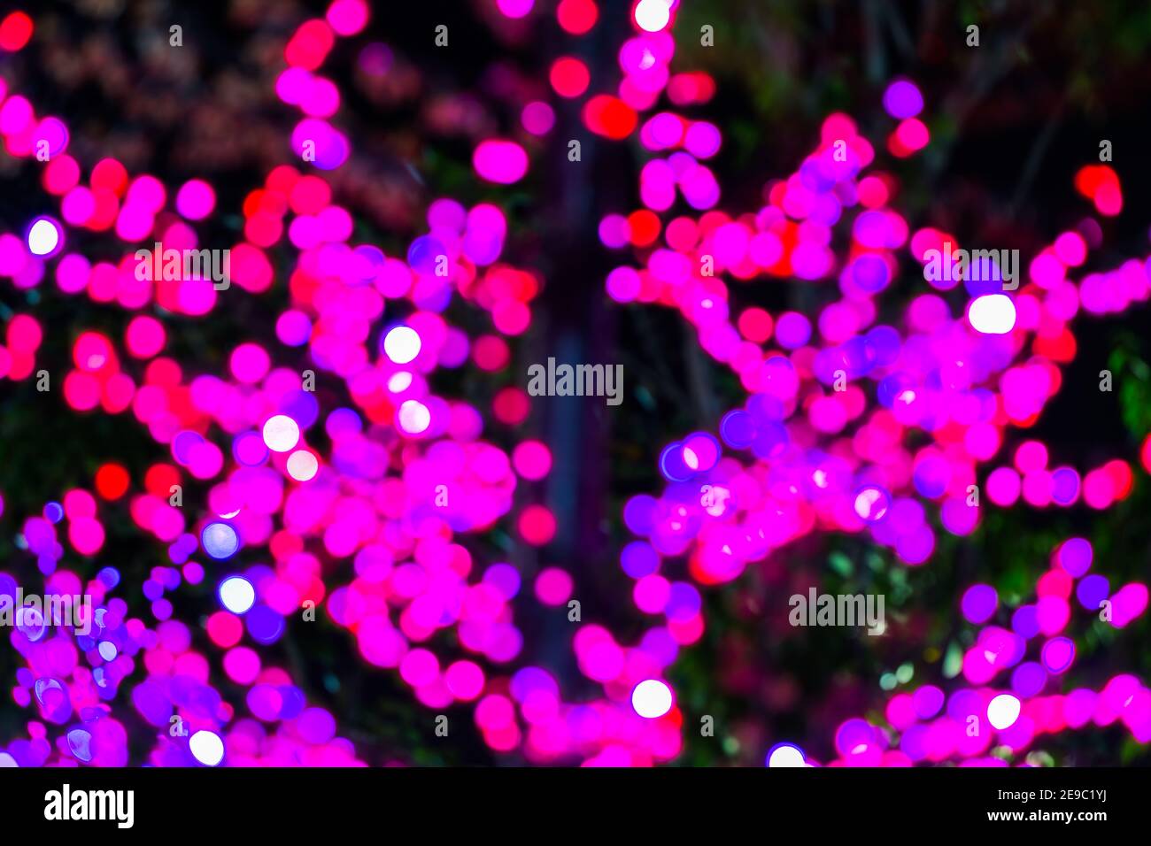 Multicolored defocused lights background Stock Photo - Alamy