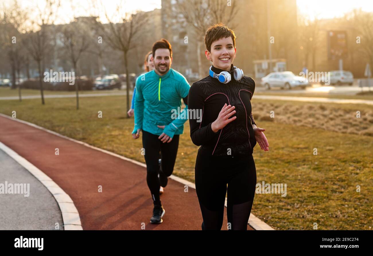 Fitness, sport, friendship and lifestyle concept. Smiling sporty couple ...