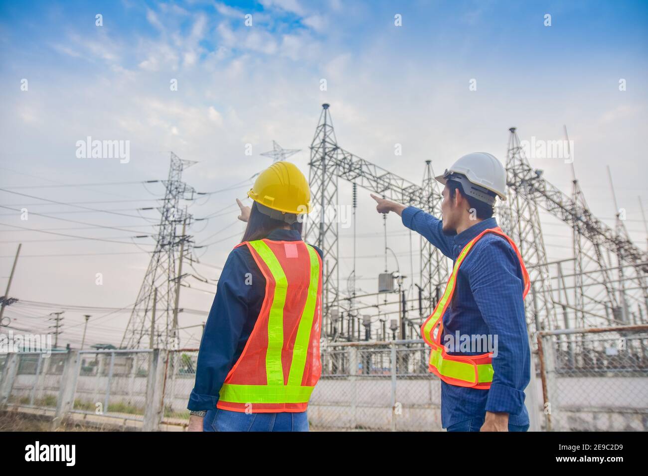 Asian Engineer Man and Women working on site power plant electric ...