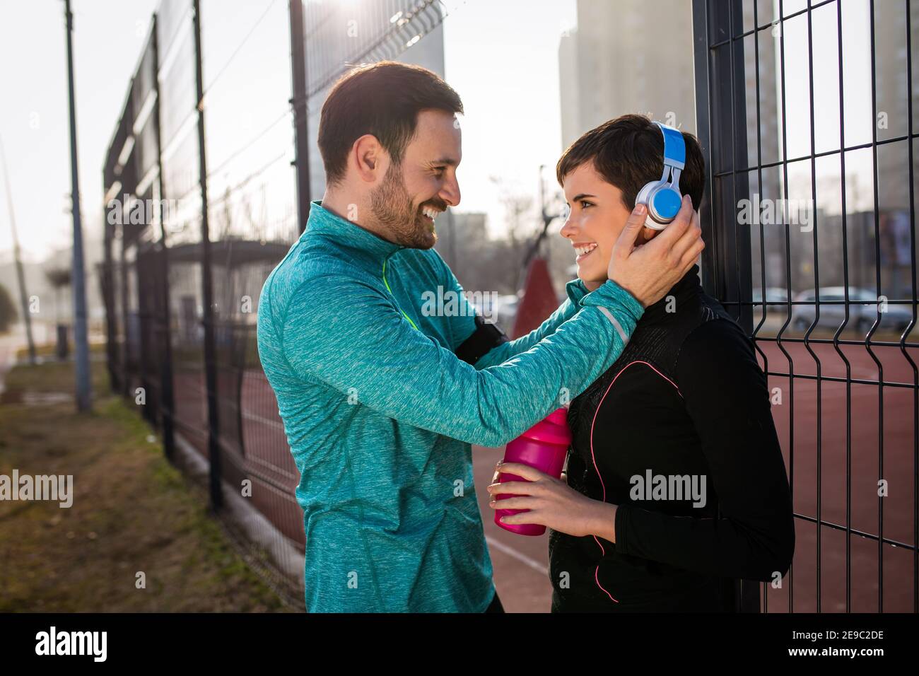 Fitness, sport, friendship and lifestyle concept. Smiling sporty couple ...