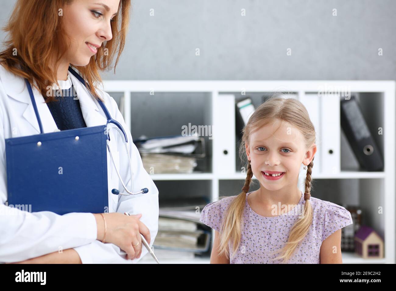 Little child at pediatrician reception Stock Photo - Alamy