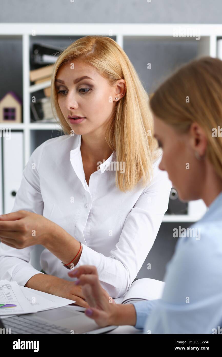 Group of people deliberate on white board problem Stock Photo - Alamy