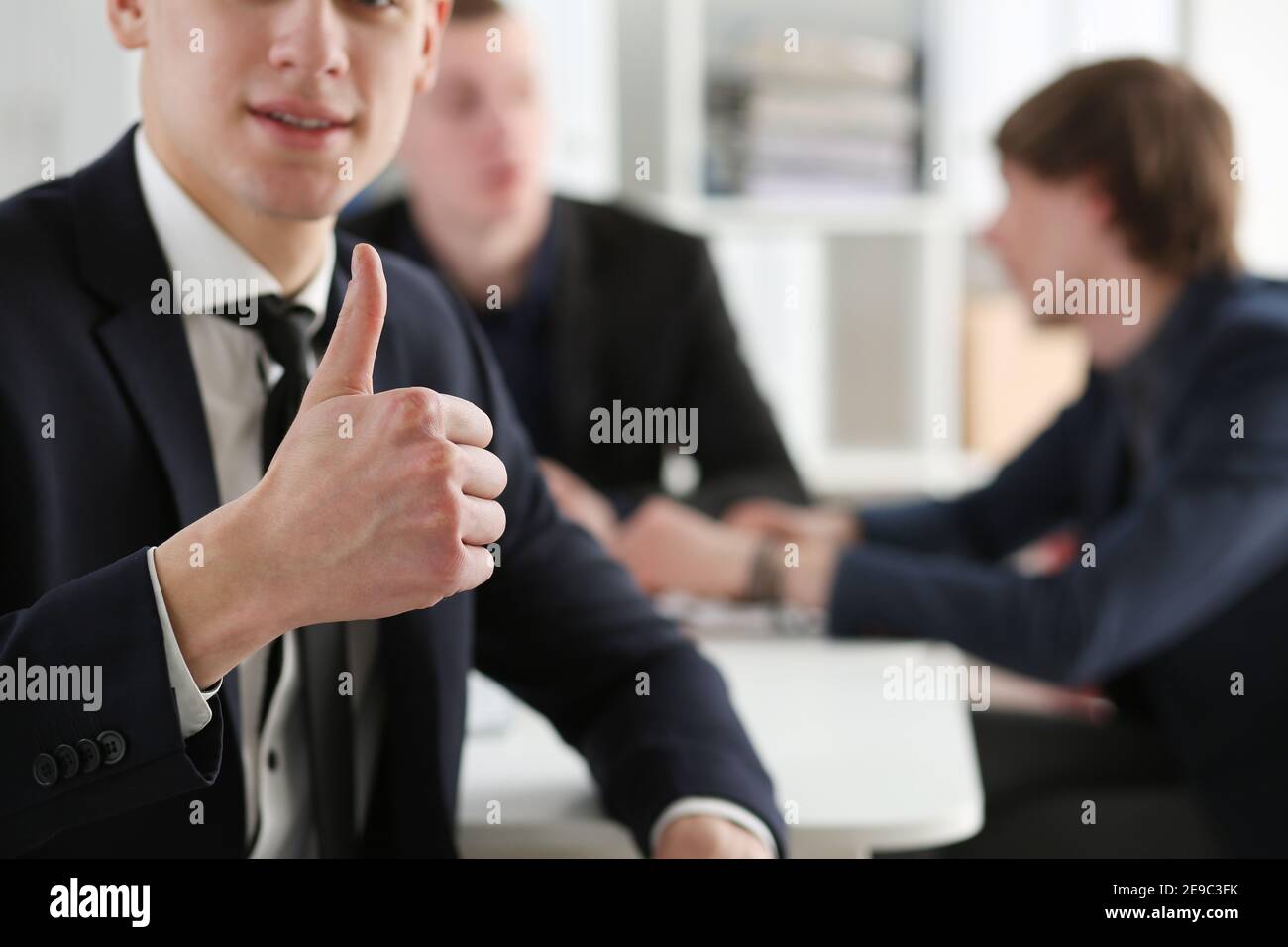 Male hand showing OK or approval sign with thumb up Stock Photo - Alamy
