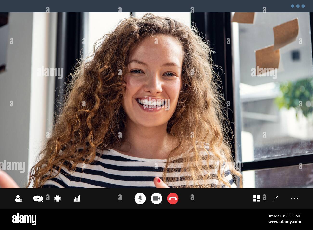Happy pretty Caucasian woman smiling at the camera while making video ...