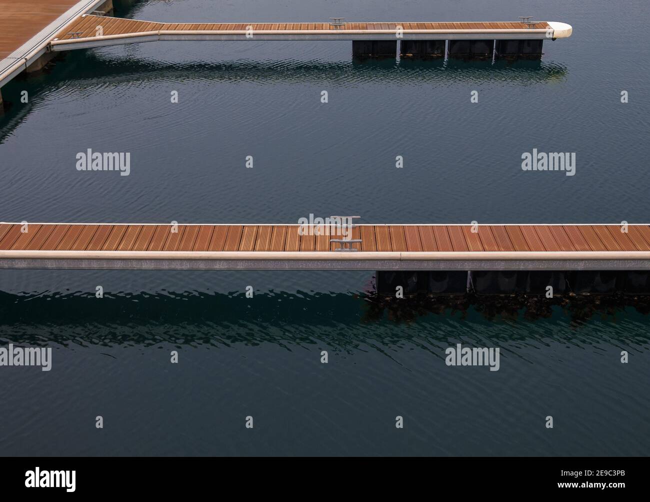 High angle shot of floating wooden docks on a water surface Stock Photo ...