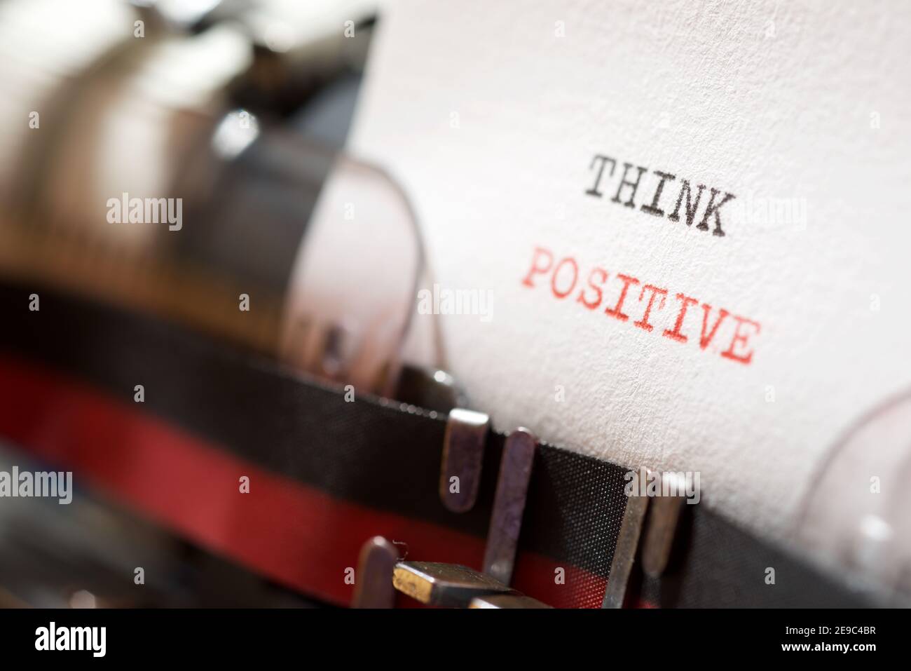 Think positive phrase written with a typewriter Stock Photo - Alamy