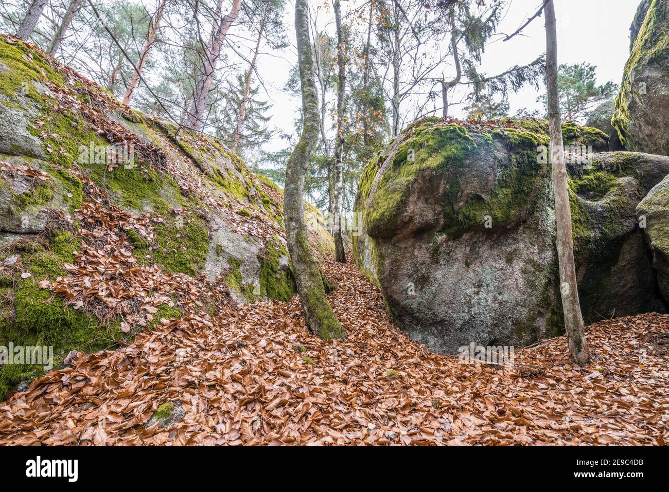 Ancient weathered megalithic granite rock formation with cave and ...