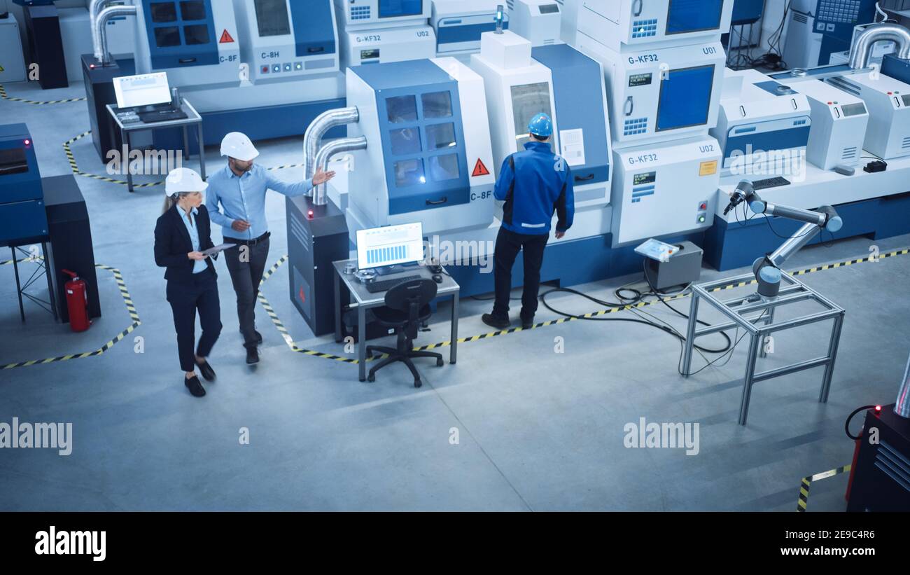 Industry Four Factory: Female Executive and Chief Engineer Inspect ...