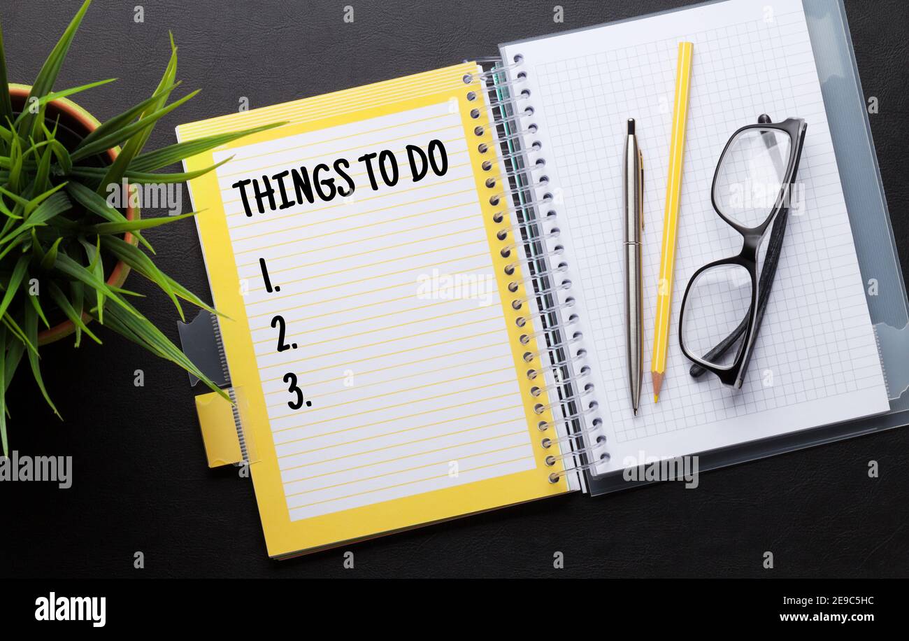 Office desk with to do list notepad and supplies. Top view flat lay ...