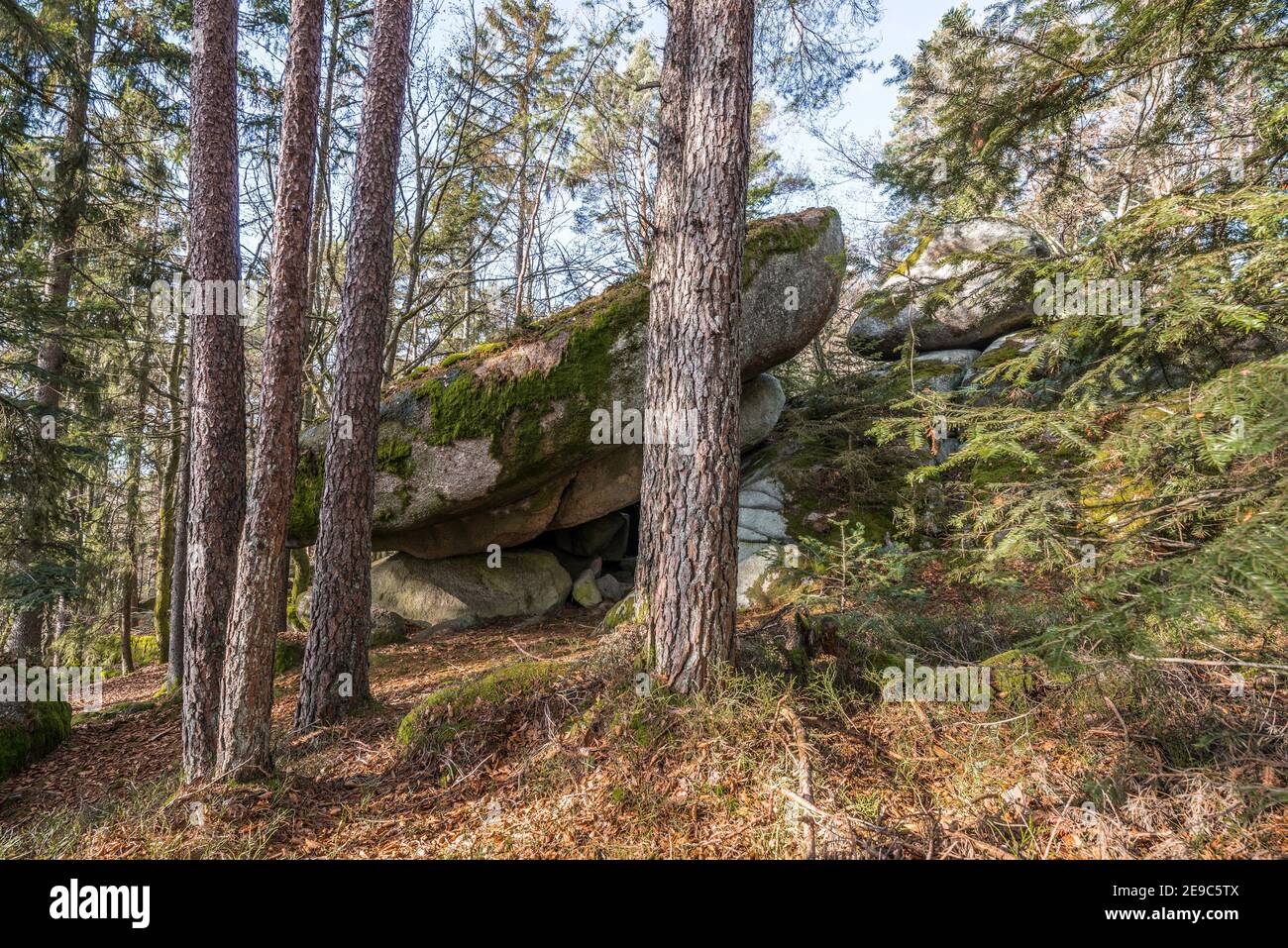 Ancient weathered megalithic granite rock formation with cave and ...