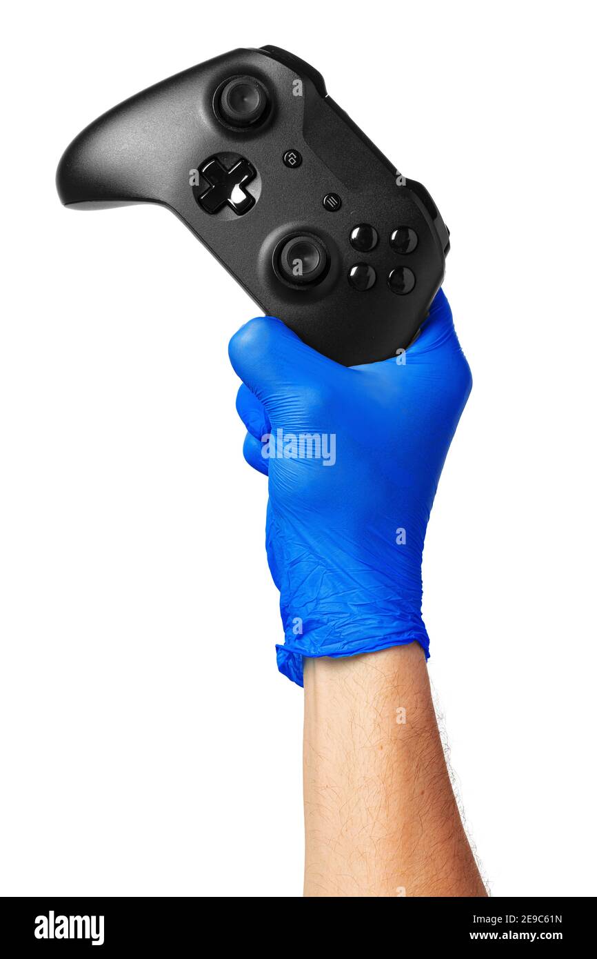 Hand holding games controller Cut Out Stock Images & Pictures - Alamy