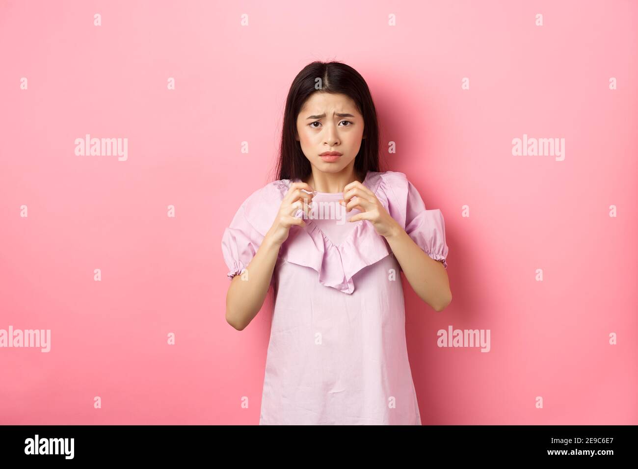 Scared asian woman victim, looking frightened, trembling from fear ...