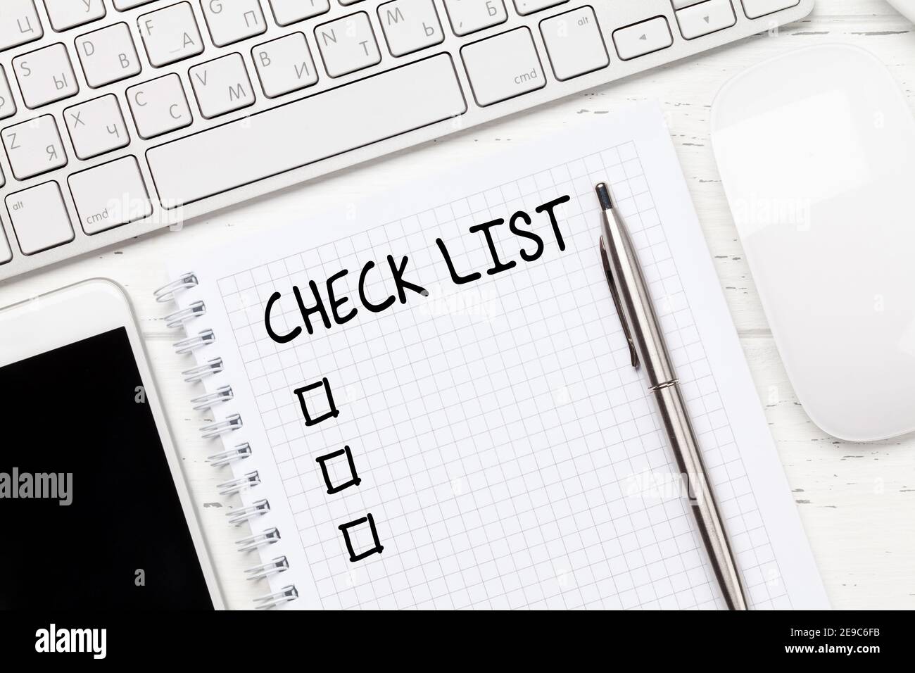Office workplace desk with check list, computer, smartphone and ...