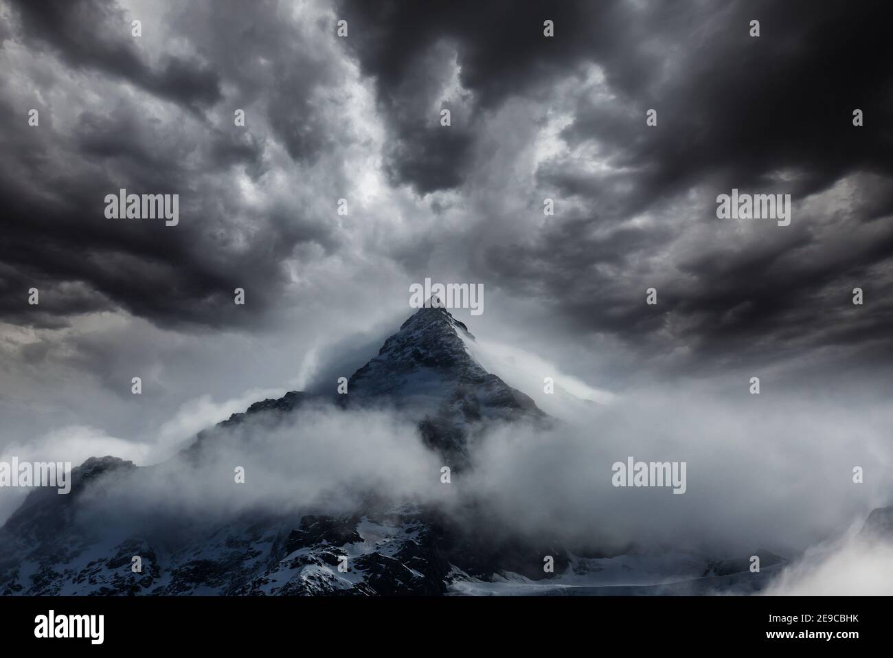 Mountain peak in storm weather Stock Photo - Alamy