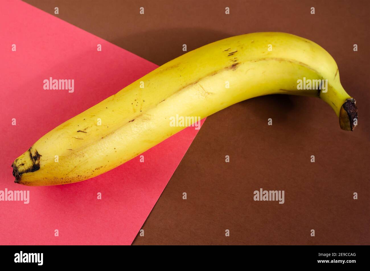 Minimalist background with one yellow banana. Ripe banana in the peel ...