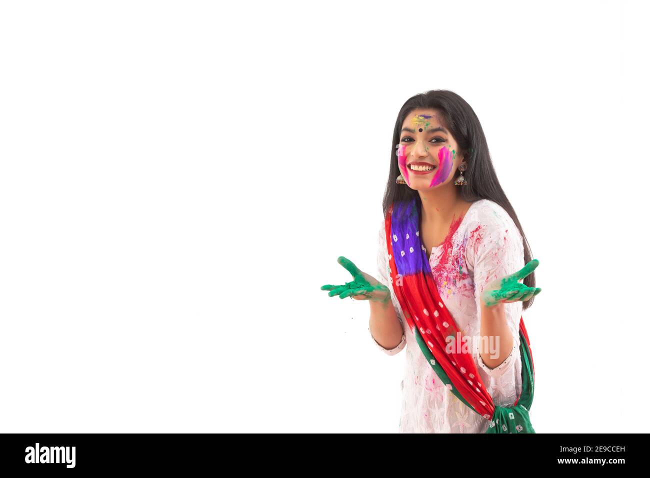 A YOUNG WOMAN WITH GULAL ALL OVER POSING IN FRONT OF CAMERA Stock Photo ...