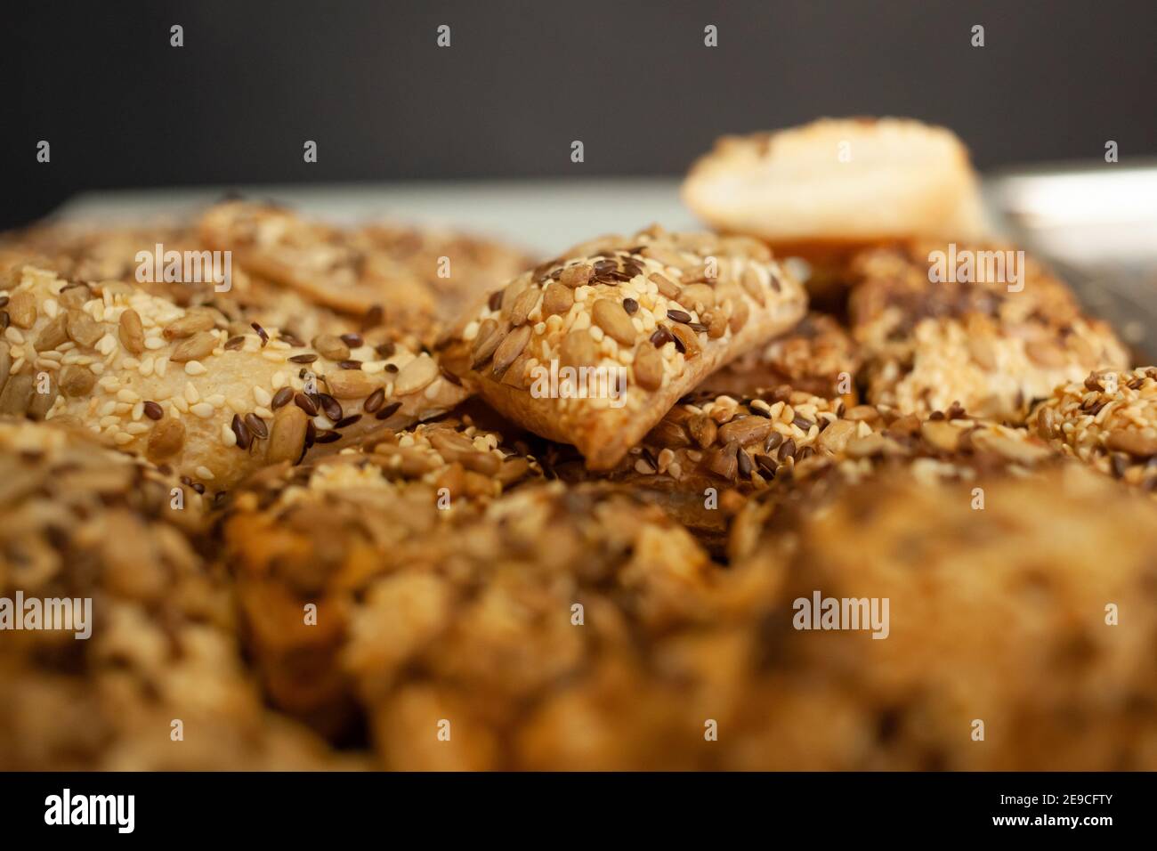 Baking with seeds, herbs and seeds on a tin tray. Natural light from ...