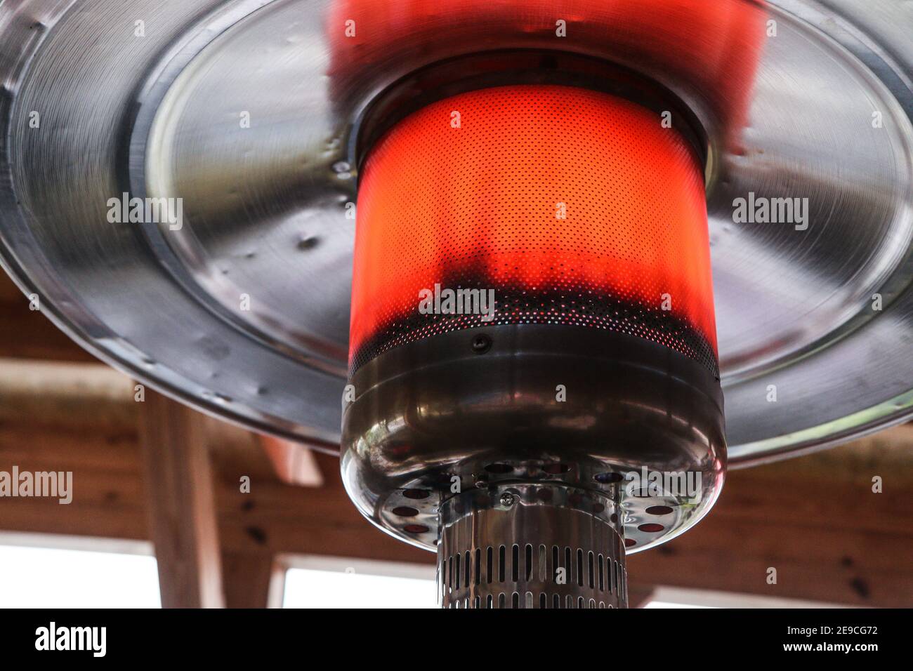 A detail picture of a part of the gas heater. It is red-hot and giving ...
