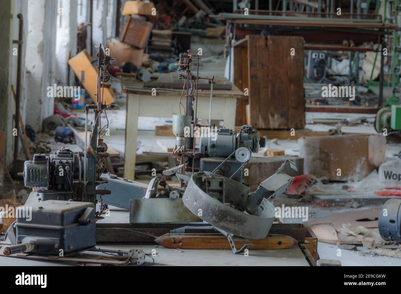 small machine on workbench in abandoned factory Stock Photo - Alamy