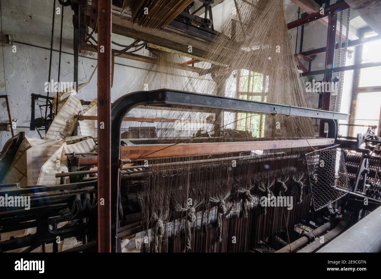 abandoned spinning with old yarn machine Stock Photo - Alamy