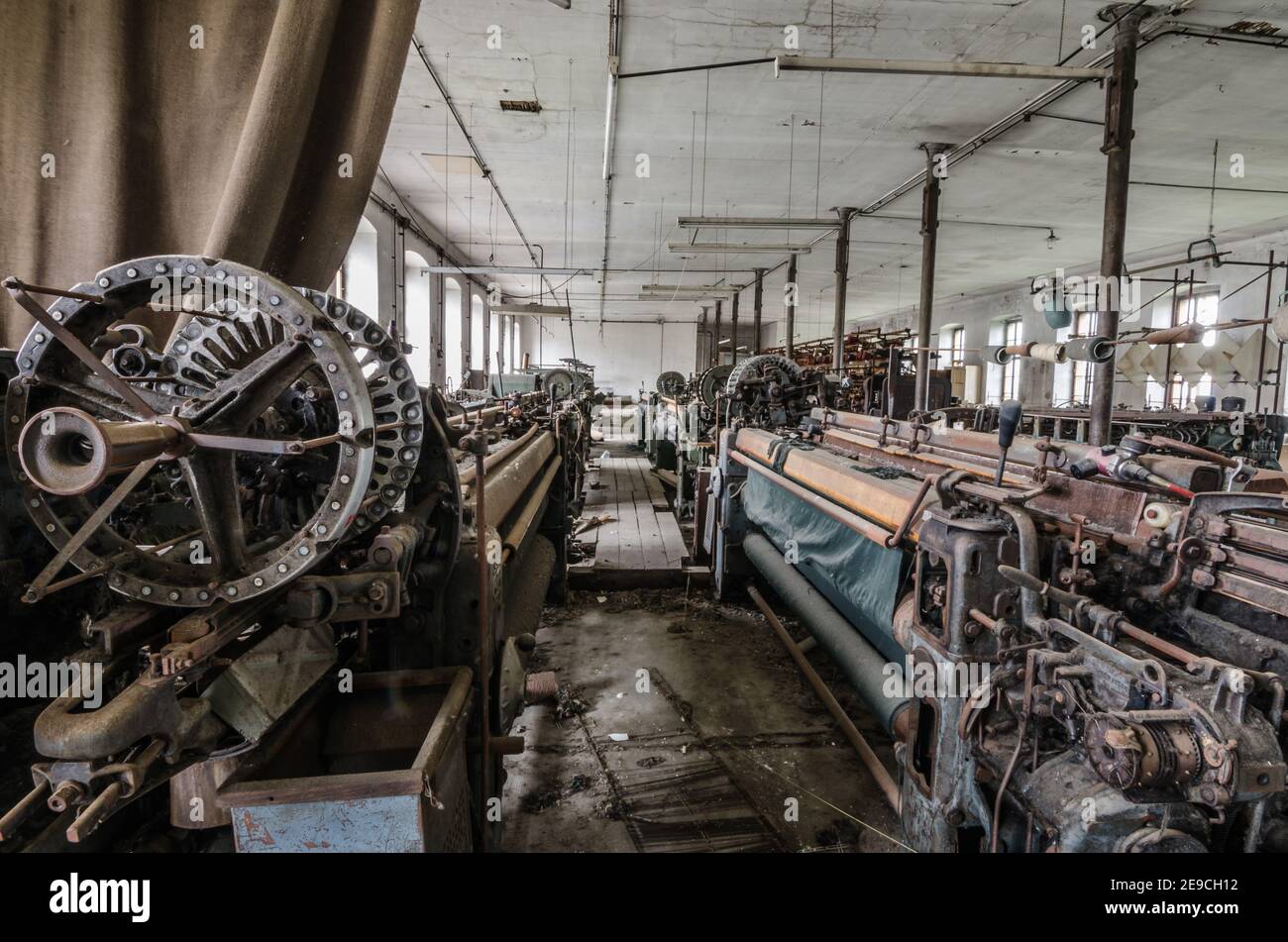 large machine hall in abandoned spinning factory Stock Photo - Alamy