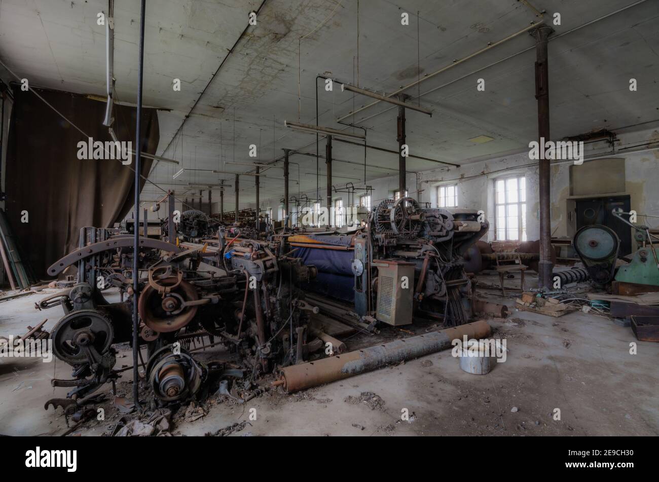 machinery in abandoned textile factory Stock Photo - Alamy