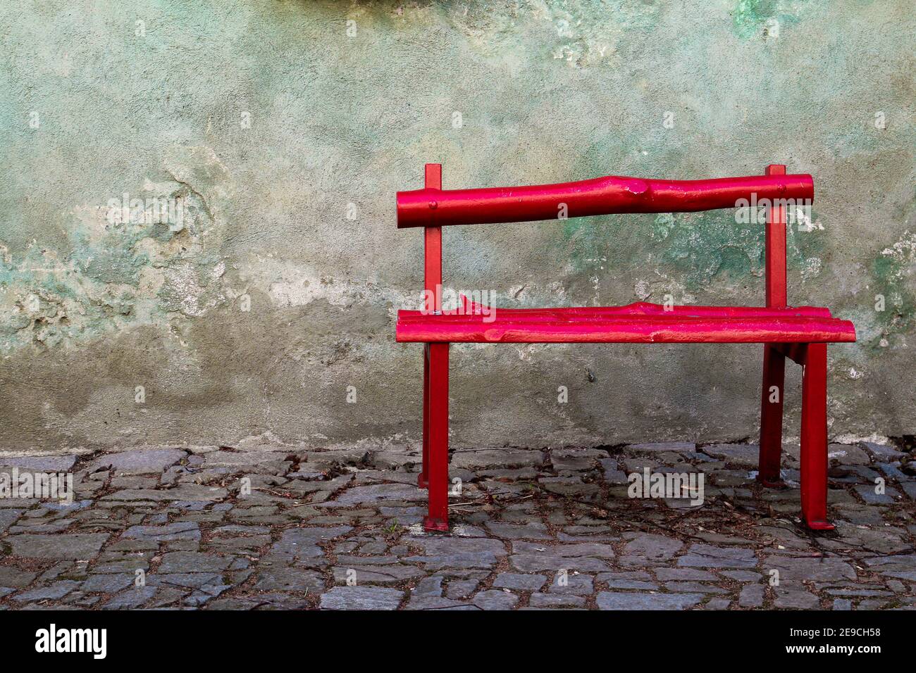 A nice and calm corner with a red wooden bench Stock Photo - Alamy